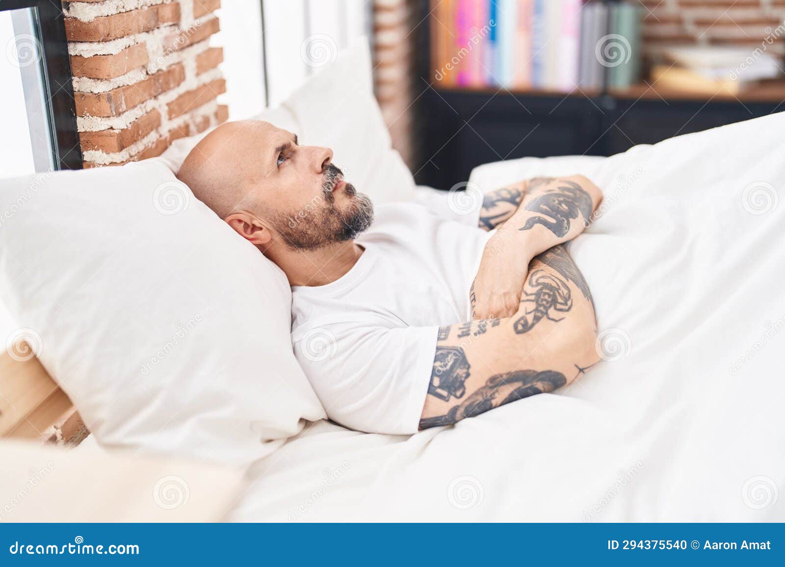 Young Bald Man Stressed Sitting on Bed at Bedroom Stock Photo - Image ...