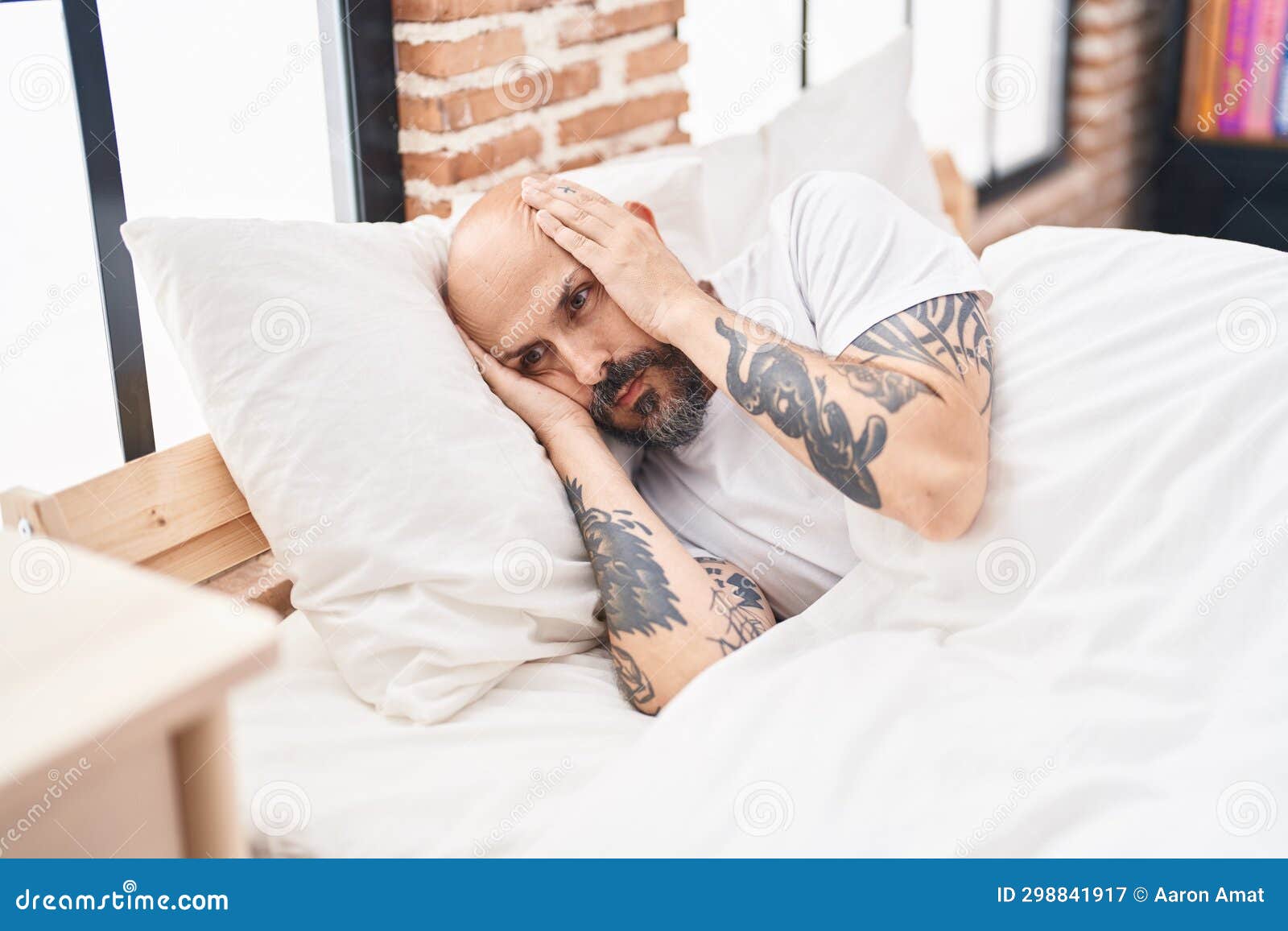 Young Bald Man Stressed Sitting on Bed at Bedroom Stock Image - Image ...