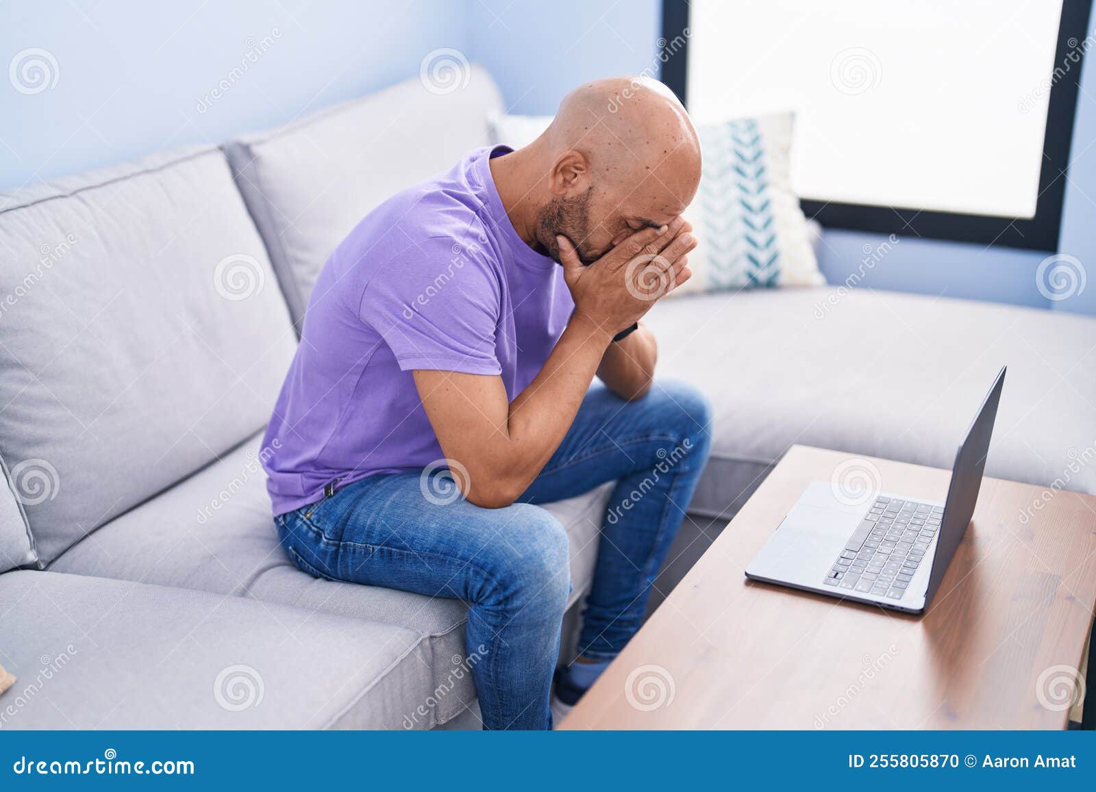 Young Bald Man Stressed Sitting on Sofa at Home Stock Photo - Image of ...