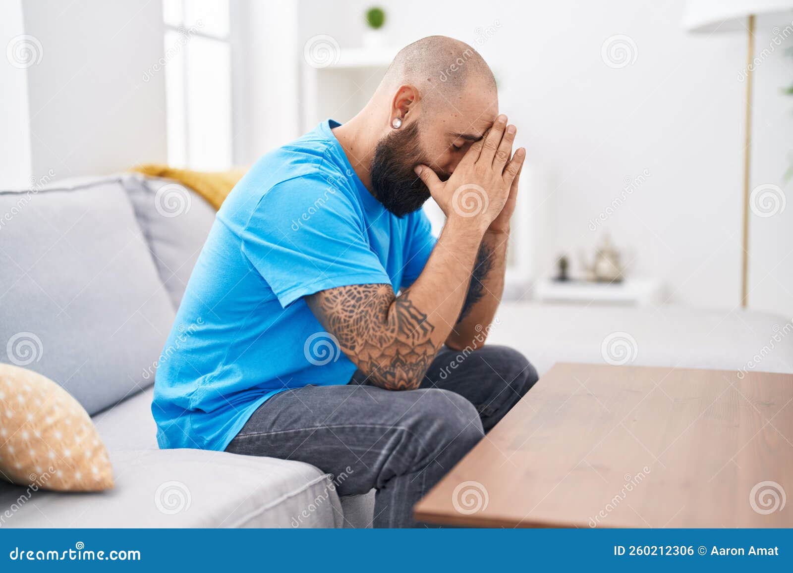 Young Bald Man Stressed Sitting on Sofa at Home Stock Photo - Image of ...
