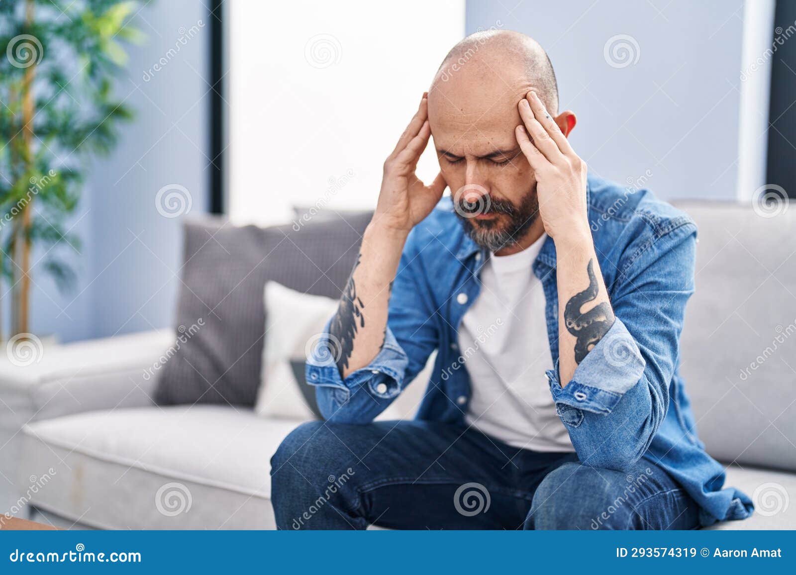 Young Bald Man Stressed Sitting on Sofa at Home Stock Image - Image of ...