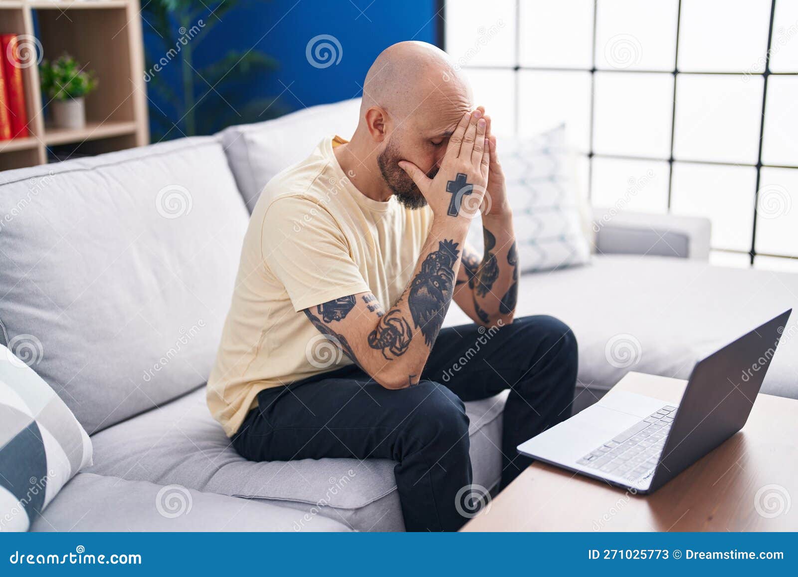 Young Bald Man Stressed Using Laptop Sitting on Sofa at Home Stock ...