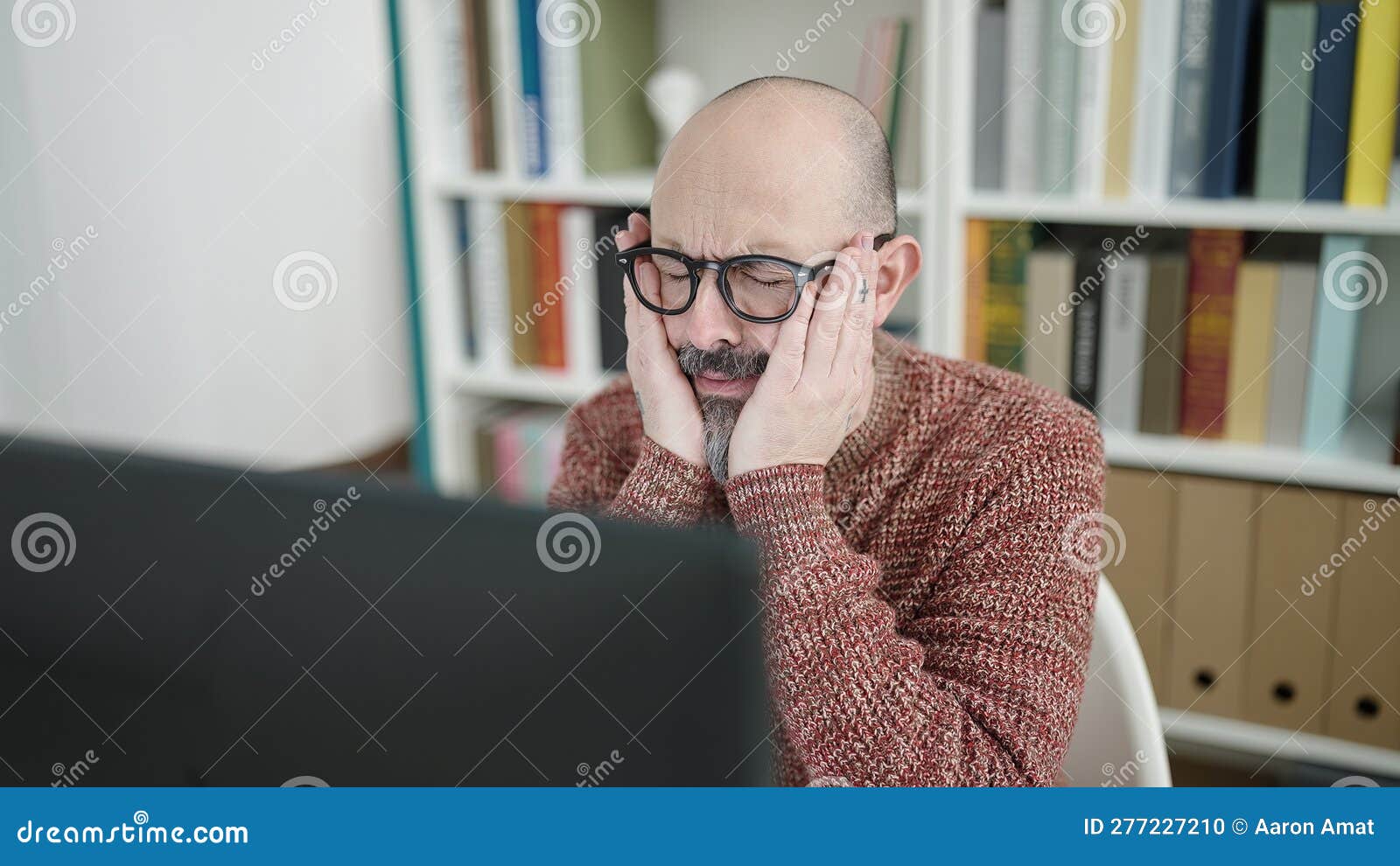Young Bald Man Student Using Computer Stressed at University Classroom ...