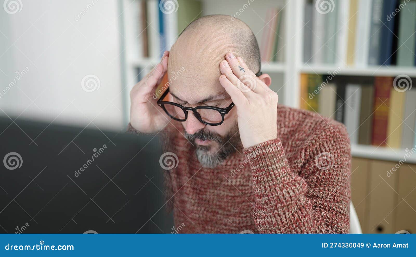 Young Bald Man Student Using Computer Stressed at University Classroom ...