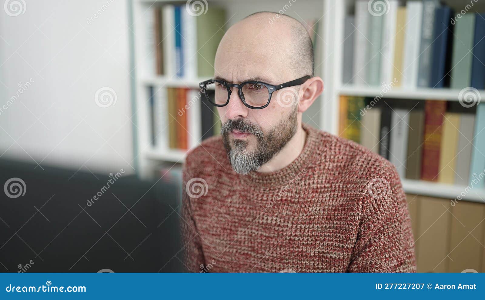 Young Bald Man Student Using Computer Studying at University Classroom ...