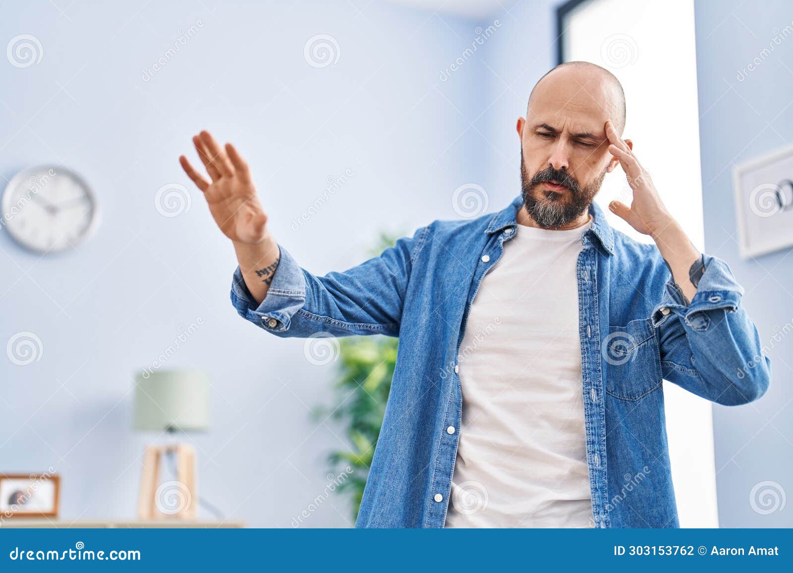Young Bald Man Suffering Dizzy Standing at Home Stock Photo - Image of ...