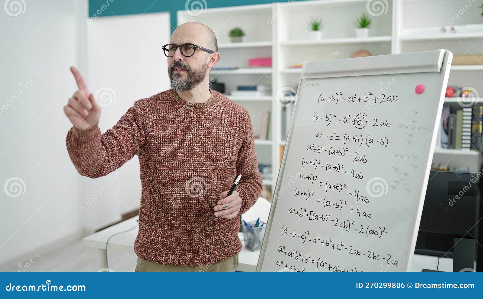 Young Bald Man Teacher Teaching Maths on Magnetic Board at University ...