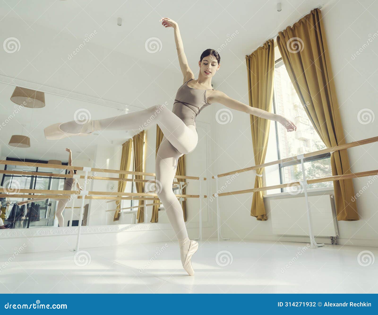 Young Ballerina in a Dance Class at a Ballet Machine Does Stretching ...