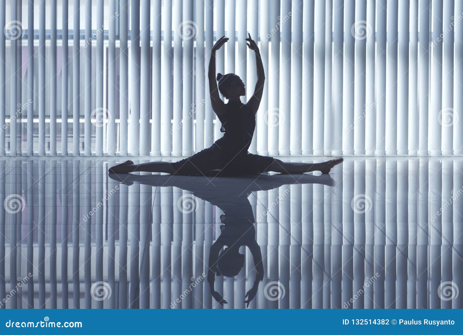 Young Ballerina Doing Split Exercise Near the Window Stock Photo ...