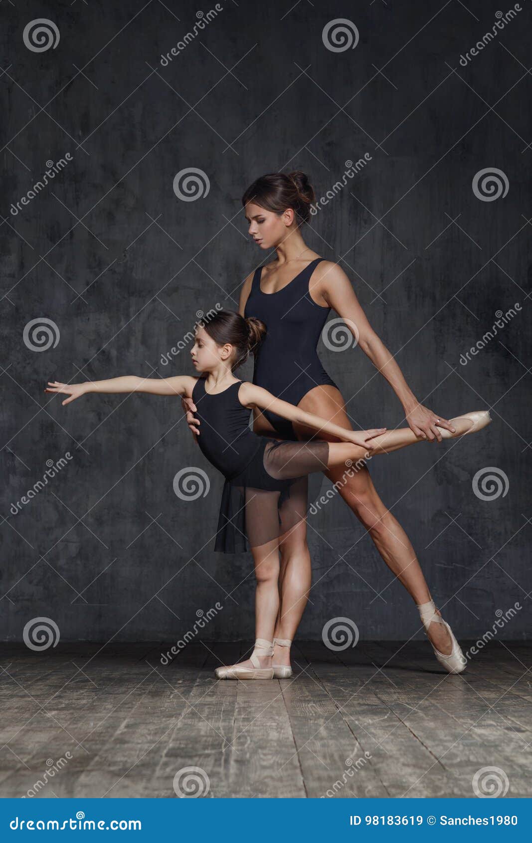Young Ballerina Posing with the Ballet Teacher in Studio Stock Image ...