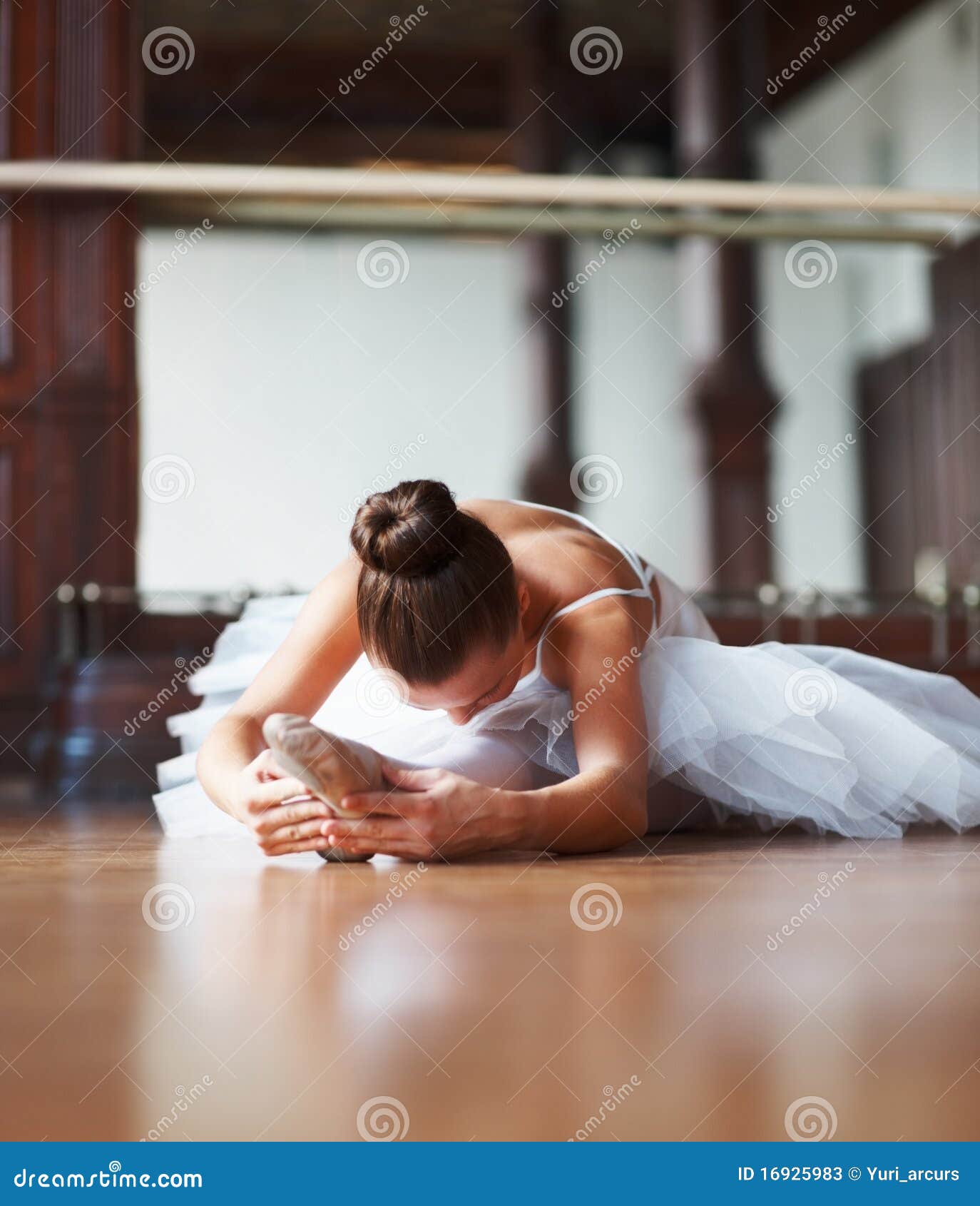 Young Ballet Dancer Stretching on Dance Floor Stock Image - Image of ...