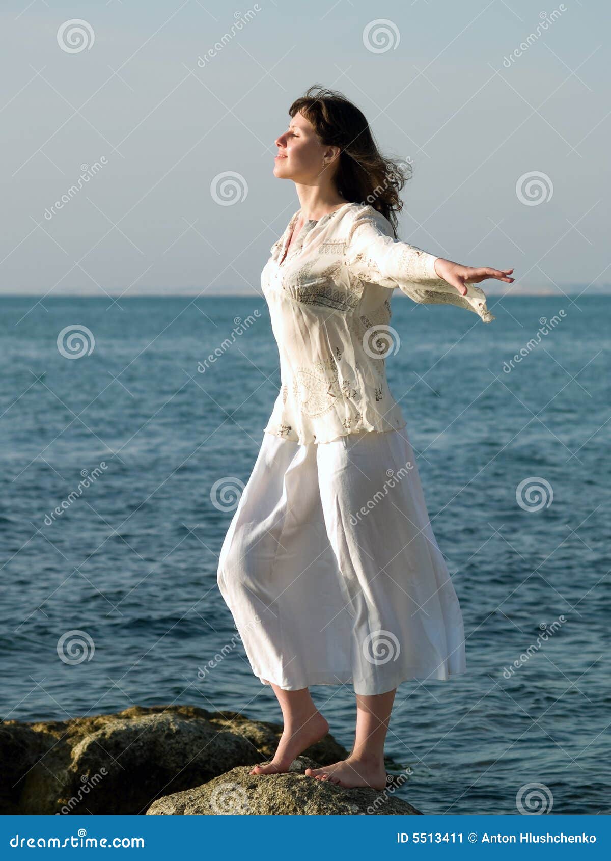 Young Barefoot Lady On Stone Arms Outstretched Royalty-Free Stock ...
