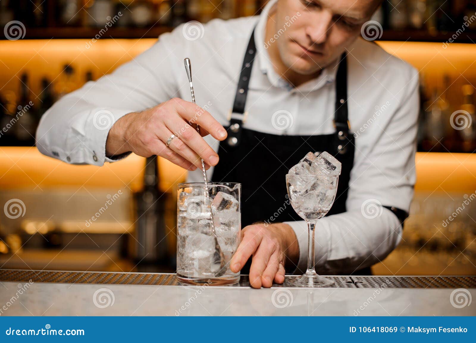 Young Barman Stirring Ice Cubes In A Glass Stock Image Image Of