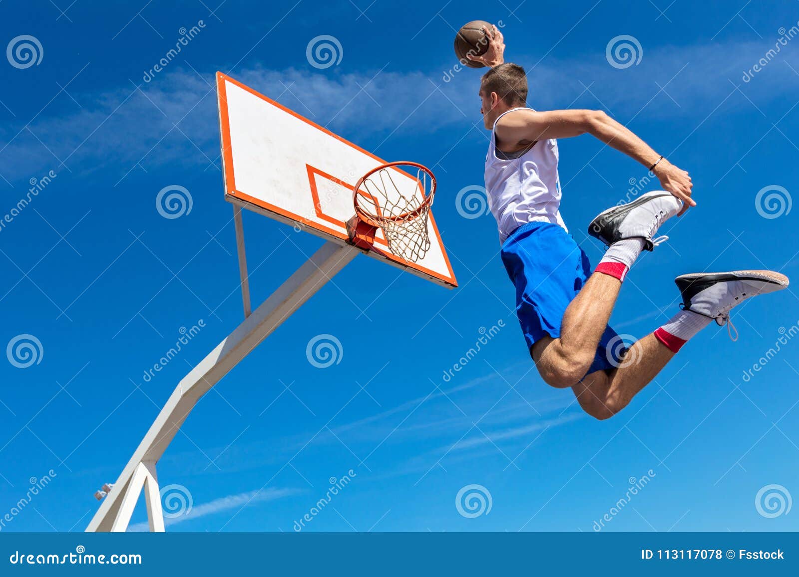 Young Basketball Street Player Making Slam Dunk Stock Photo - Image of ...