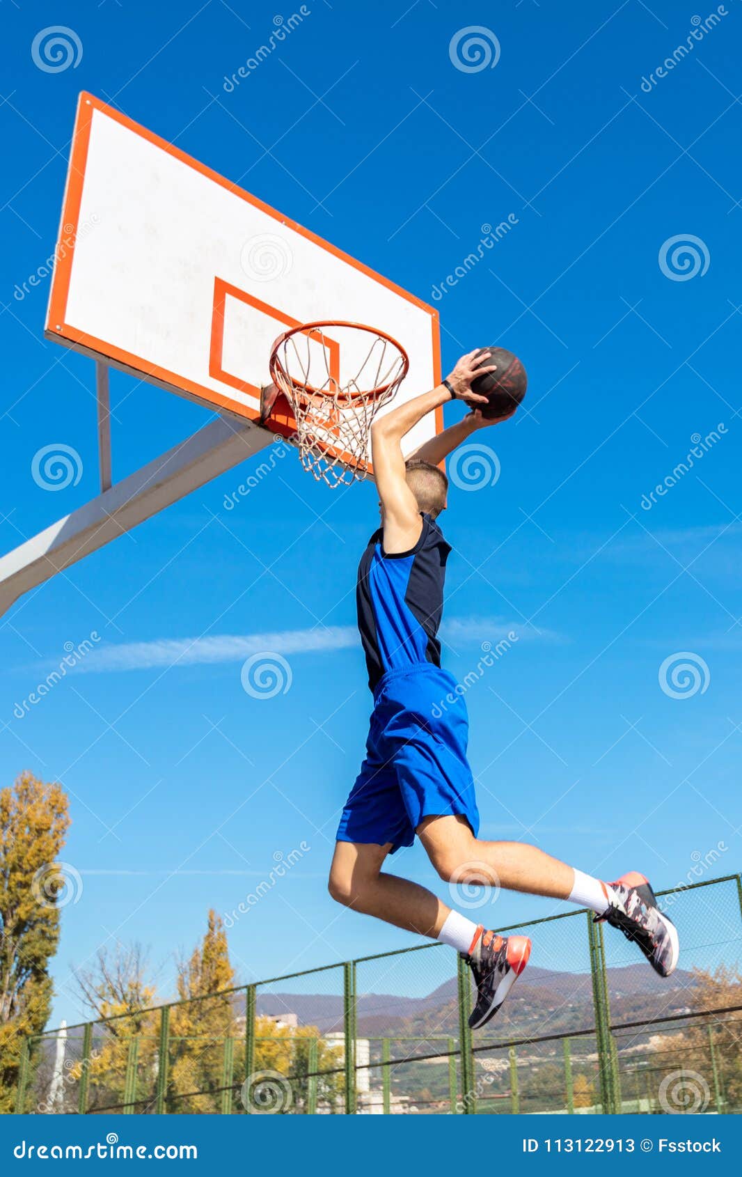 Young Basketball Street Player Making Slam Dunk Stock Image - Image of ...