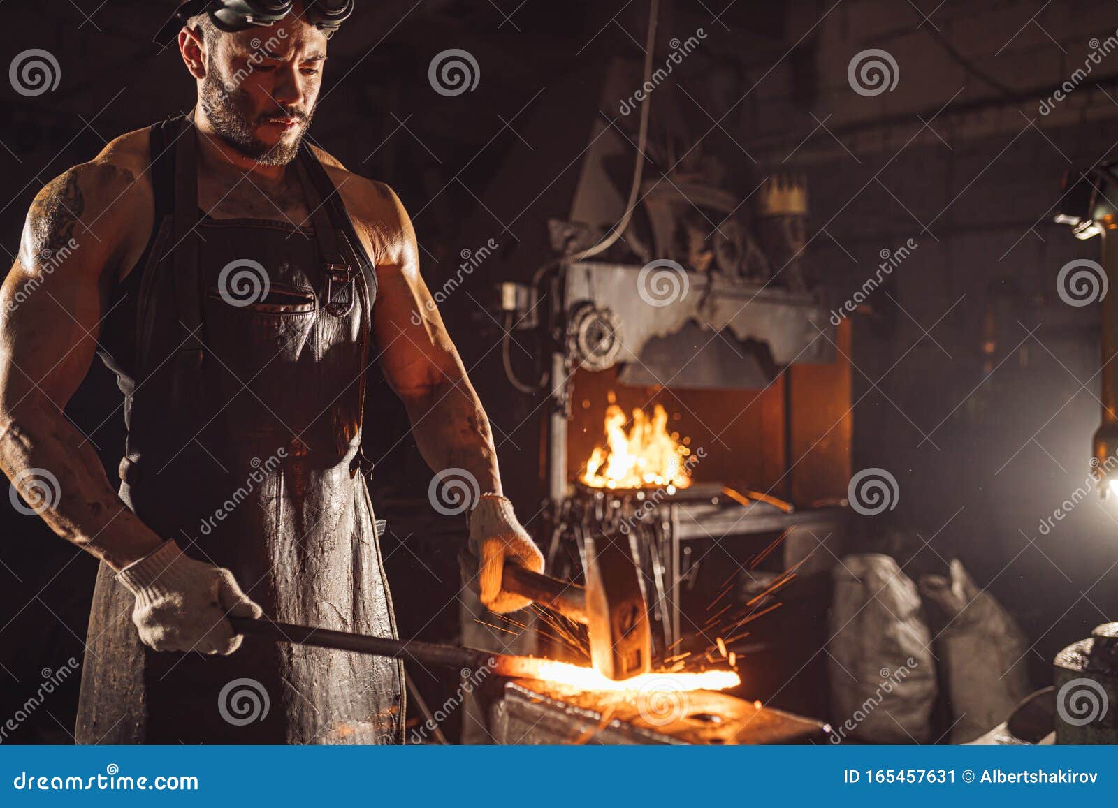 Young Bearded Blacksmith Heats the Metal Stock Image - Image of male ...
