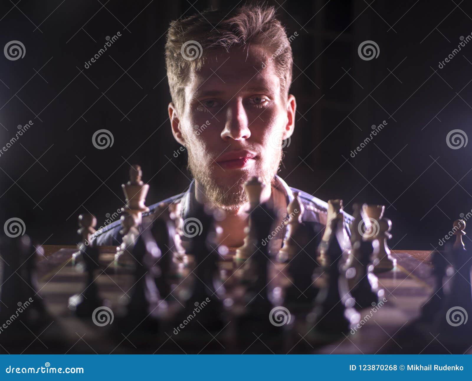 Young Bearded Chess Grandmaster Sitting and Thinking on the Move in ...