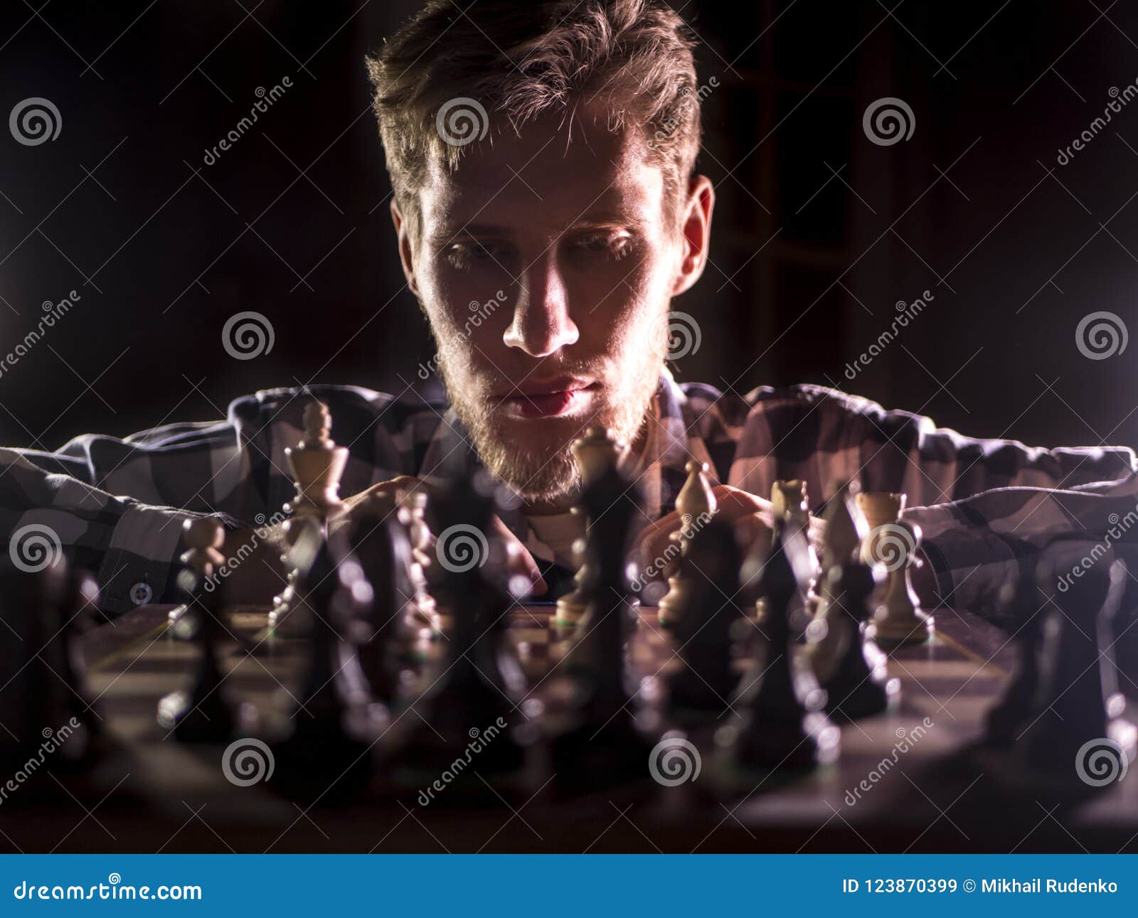 Young Bearded Chess Grandmaster Sitting and Thinking on Next Move in ...