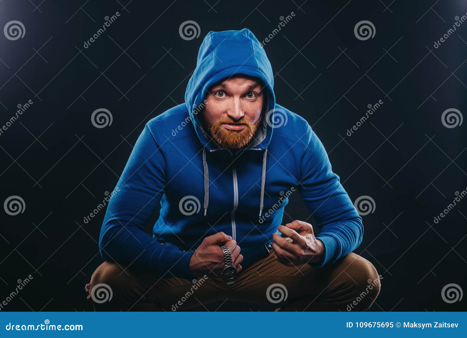Young Bearded Male Bully Sits on Black Background Stock Image - Image ...