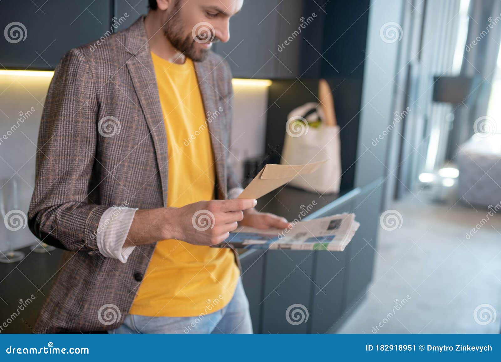 Young Bearded Man Holding an Envelope in His Hand Stock Image - Image ...
