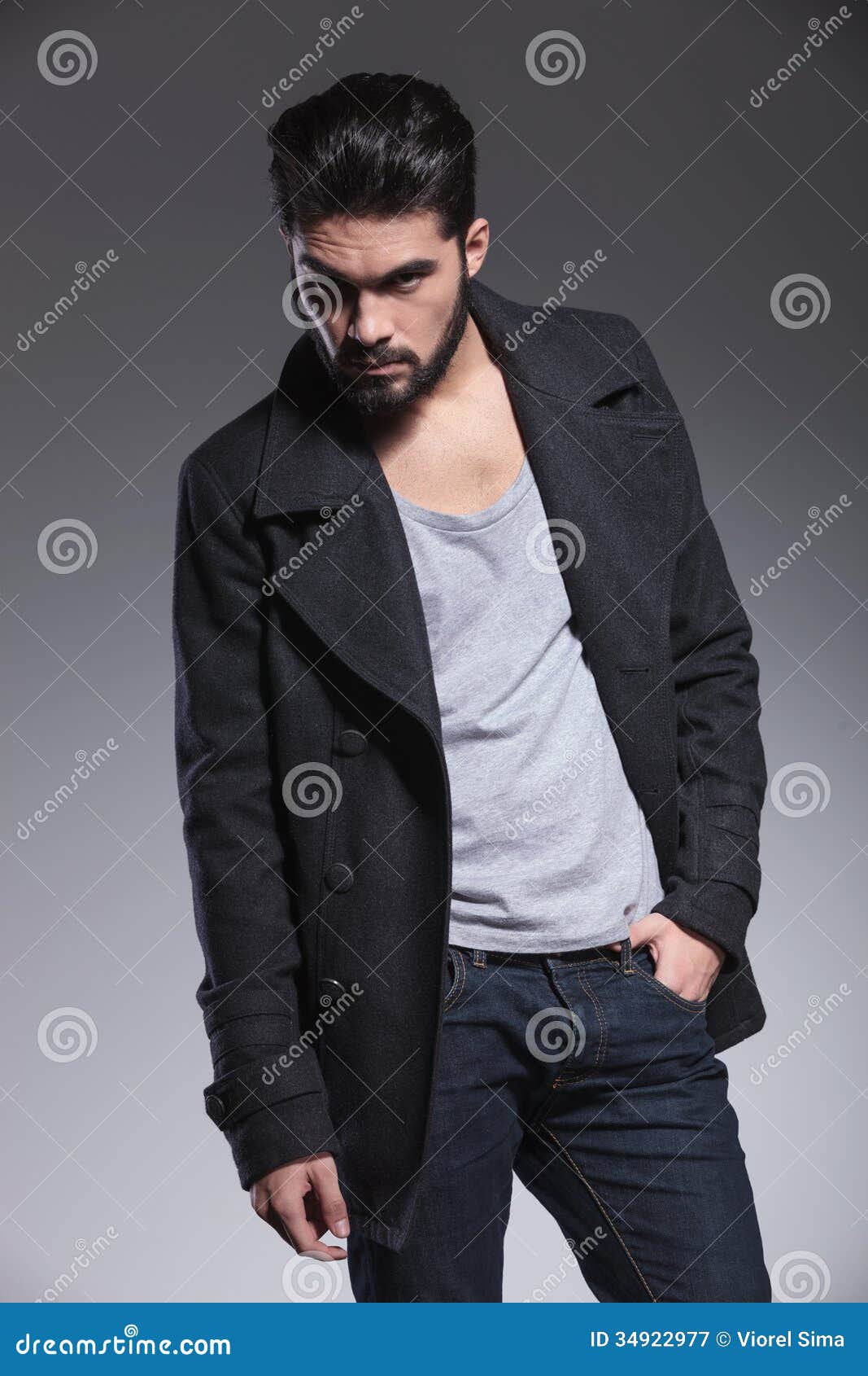 Young Bearded Man in Long Coat is Posing Stock Image - Image of ...