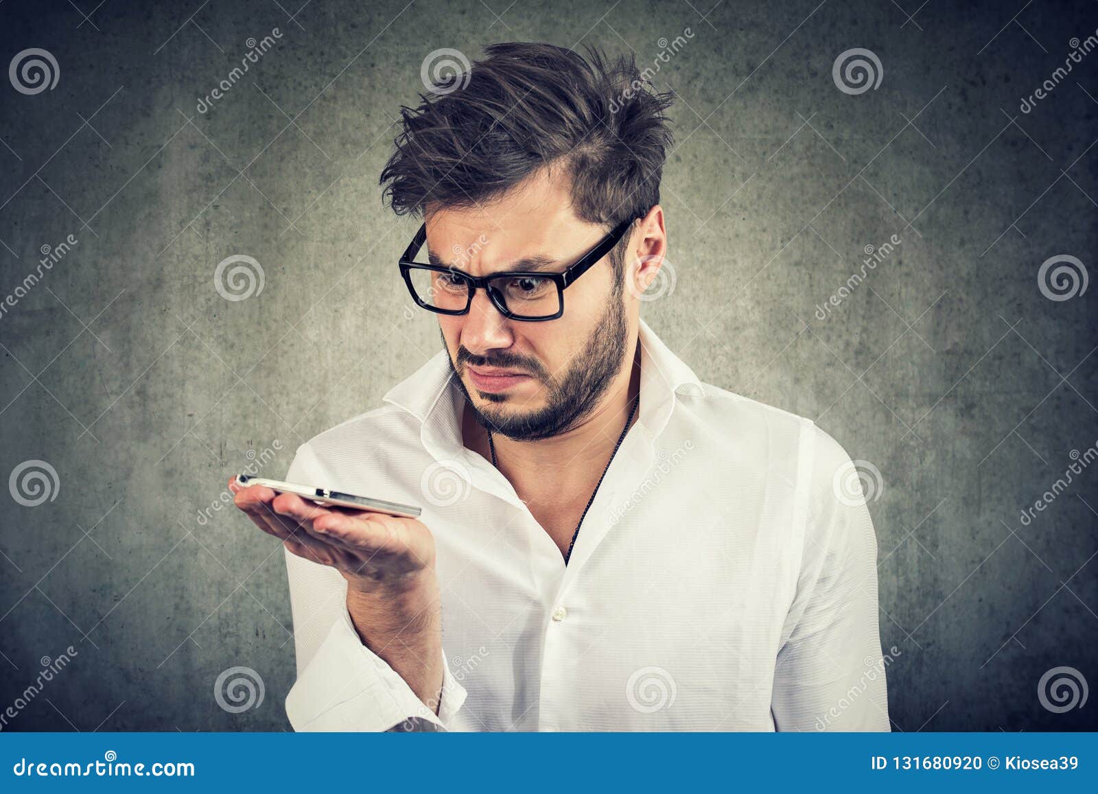 Young Bearded Man in Shirt Holding Smartphone Being Upset with Voice ...