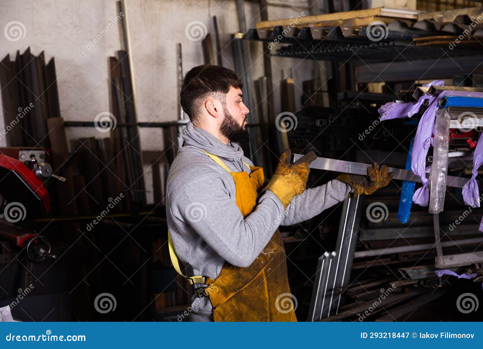 Man Taking Tubes from Rack in Workshop Stock Image - Image of ...