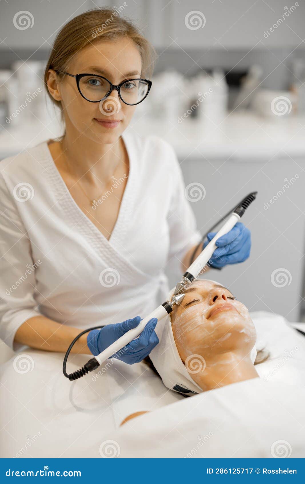 Young Beautician Doing Microcurrent Therapy on Face Stock Image - Image ...