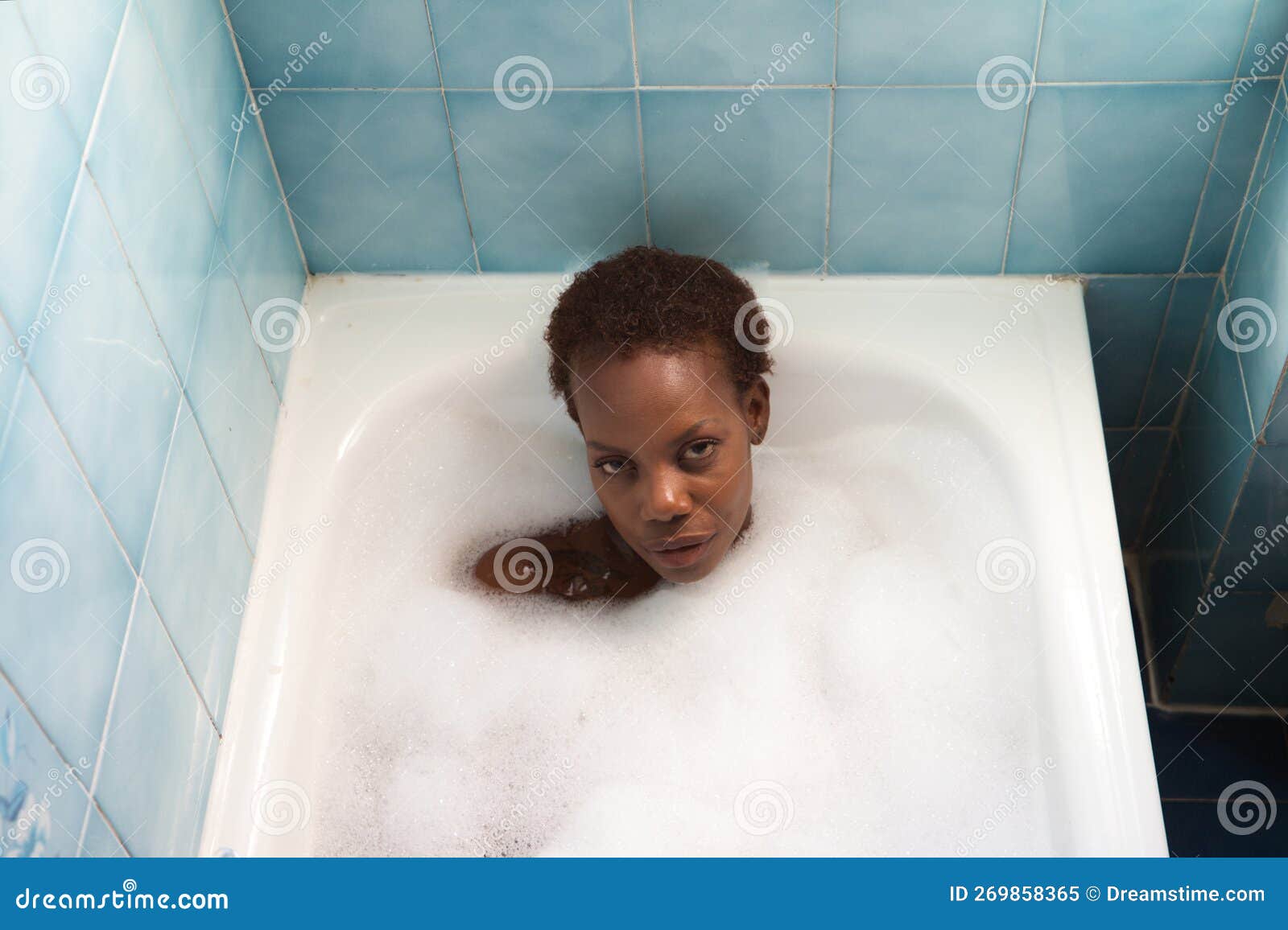 Young And Beautiful Afro American Woman Takes A Bubble Bath In The