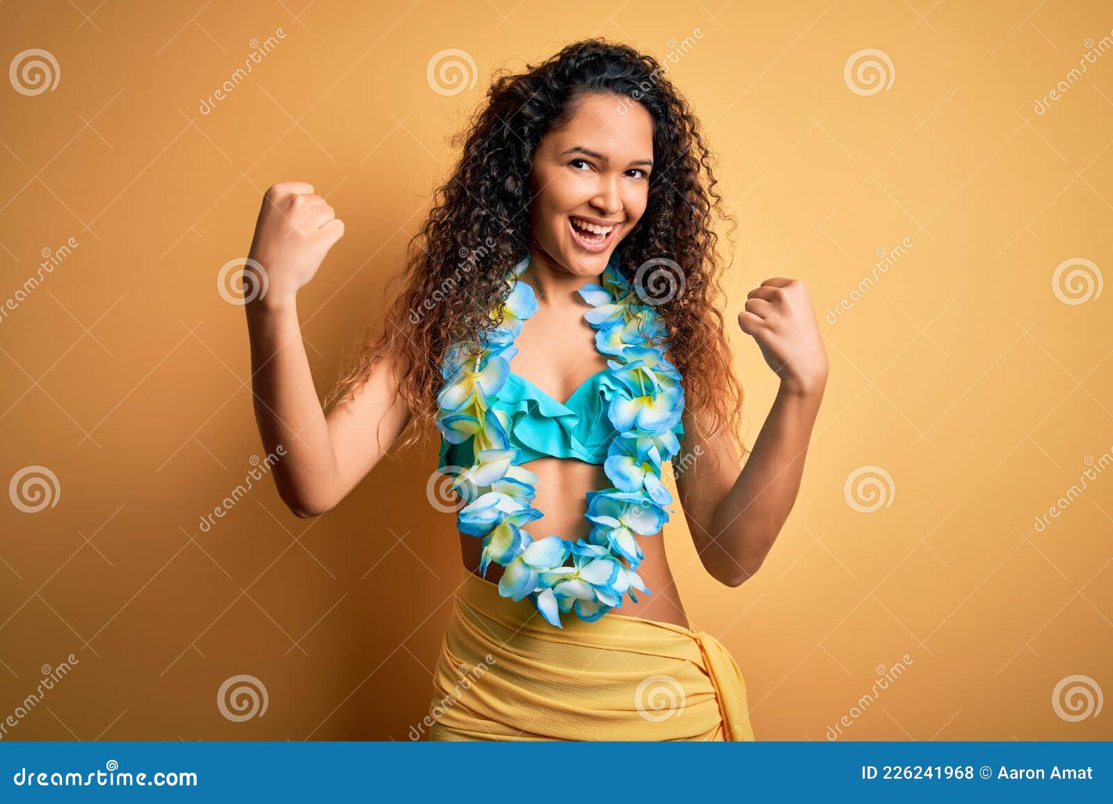 Young Beautiful American Woman On Vacation Wearing Bikini And Hawaiian Lei Flowers Celebrating