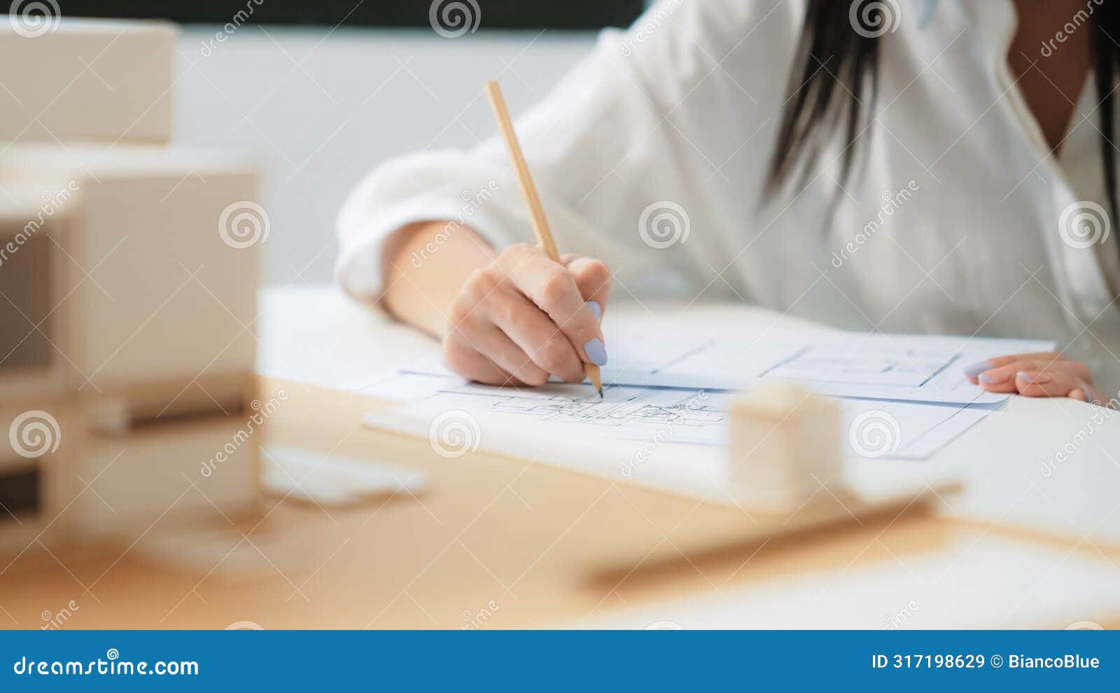Young Beautiful Architect Hand Drawing Blueprint at Modern Office ...