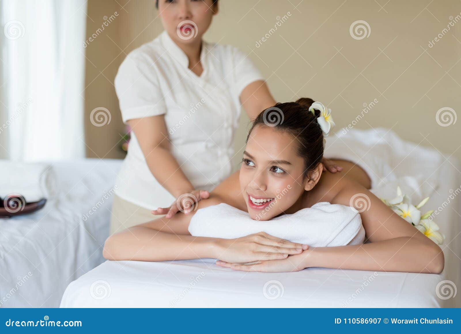 Young Beautiful Asian Woman Relaxing In The Spa Massage Stock Image