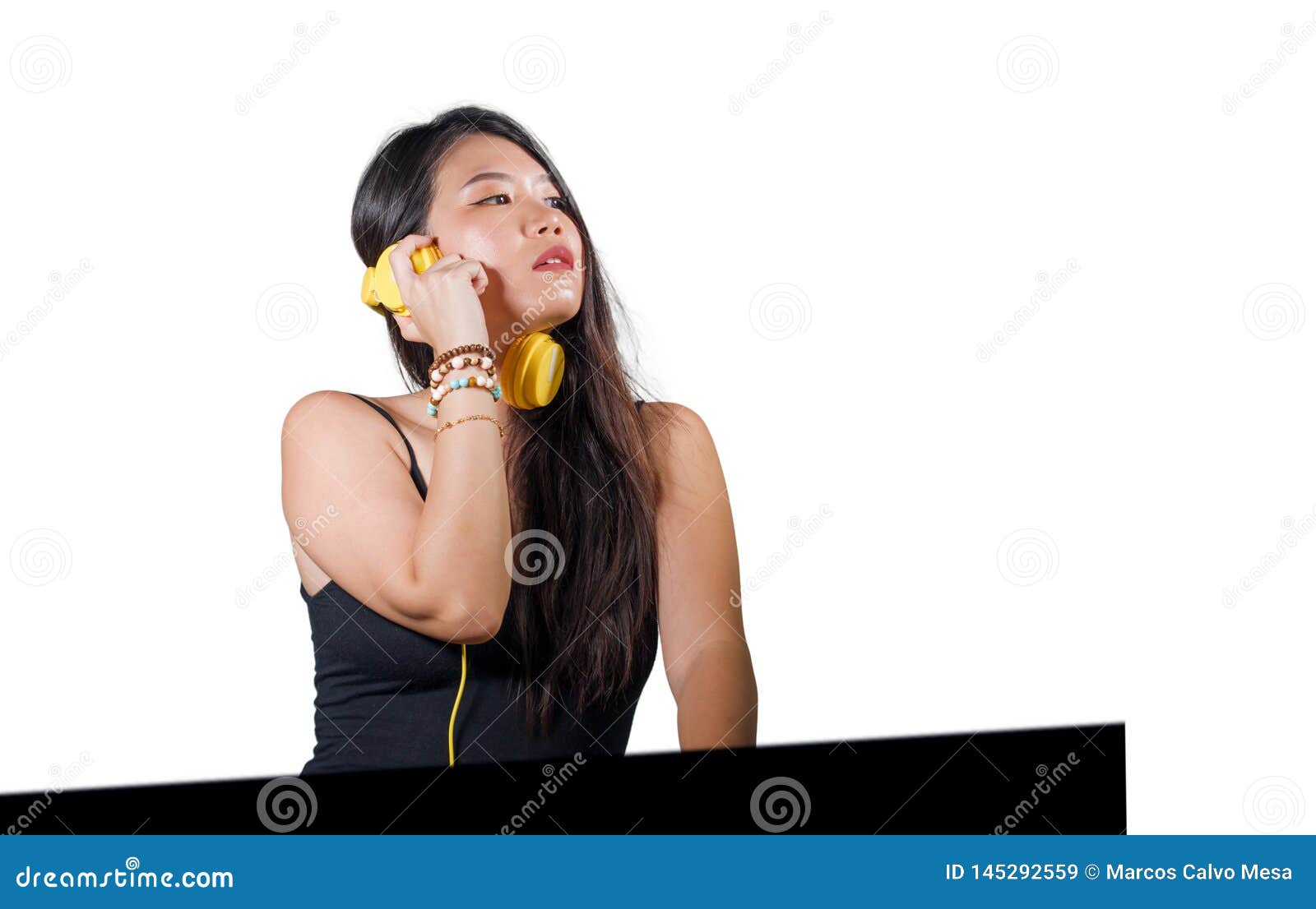 Young Beautiful And Attractive Asian Japanese Dj Woman Remixing Music