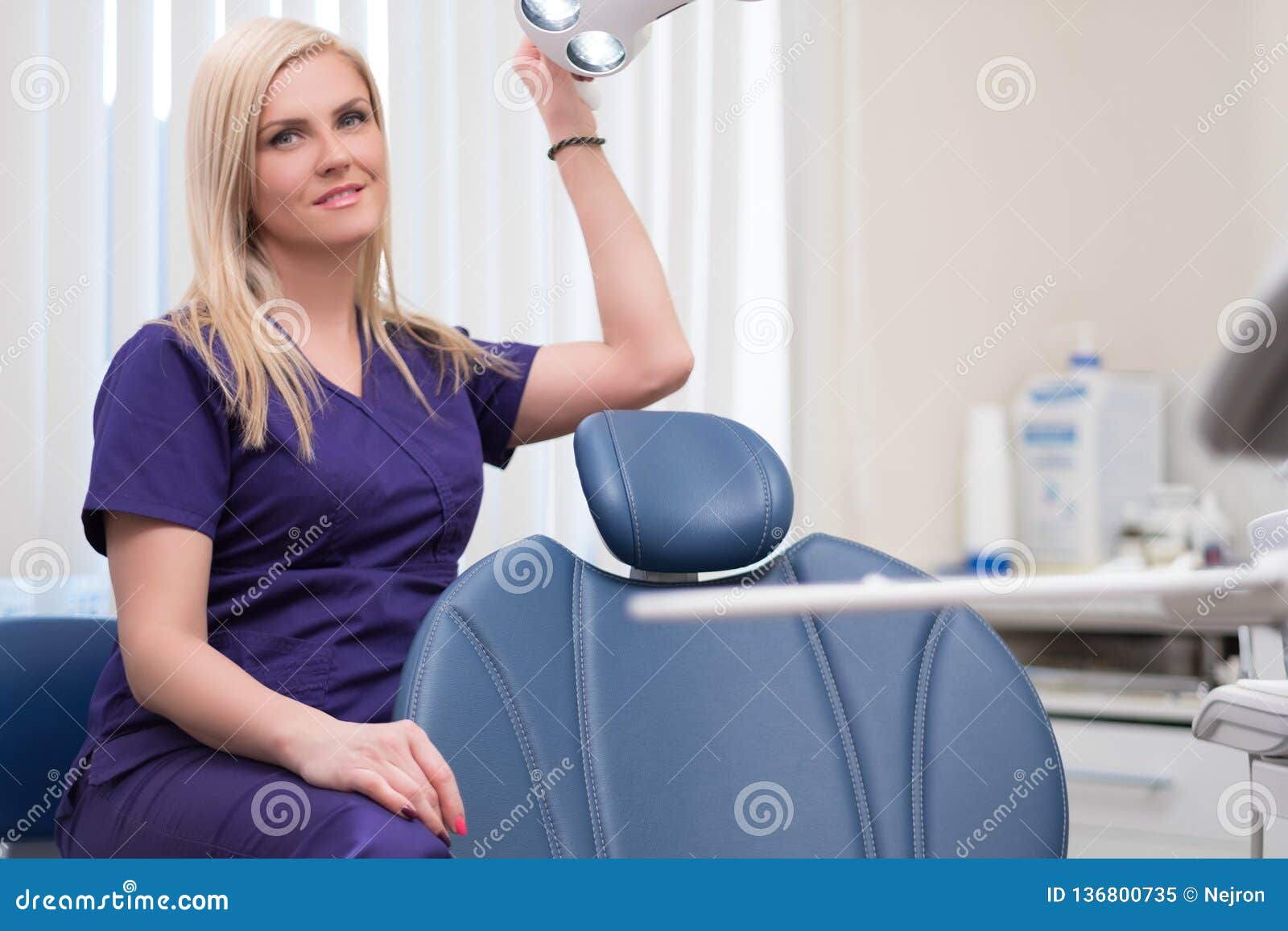 Young Beautiful Blond Woman Dentist At Dentist`s Surgery Stock Image