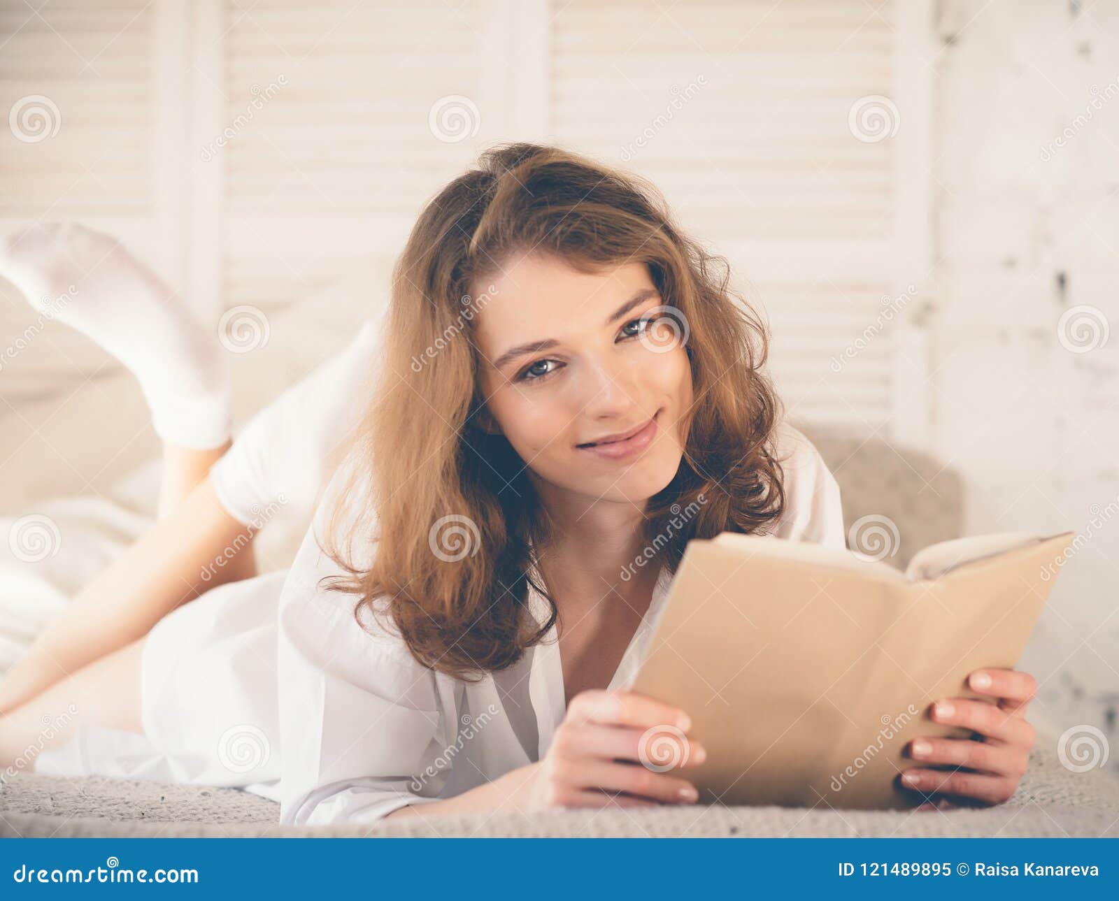 Beautiful Blond Woman Reading Book In The Bed Relaxing Concept Stock