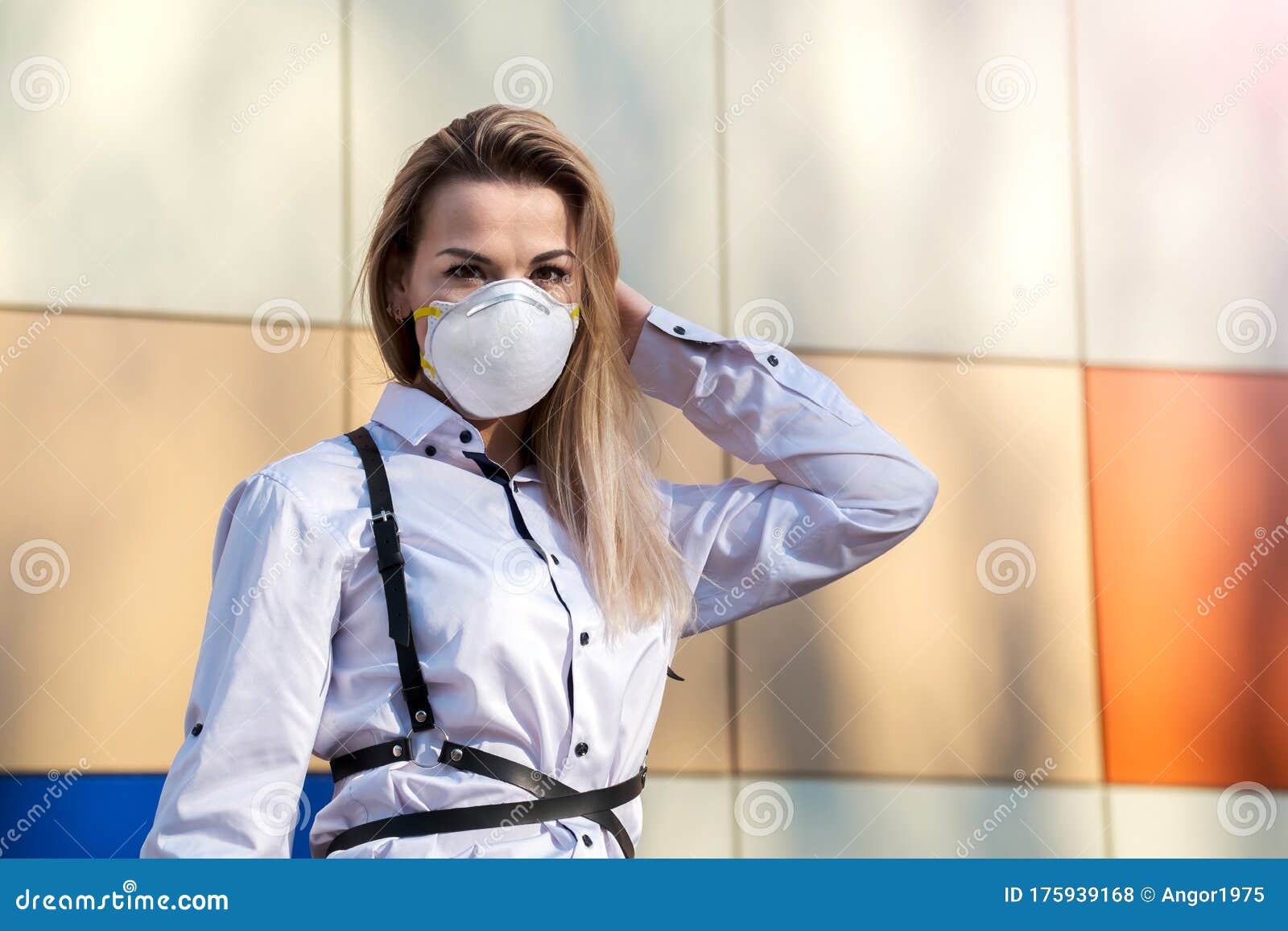 Young Beautiful Blonde Caucasian Woman Standing In A Protective Mask