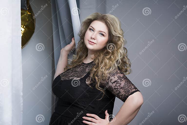 Blonde Plus Size Model In Black Dres Woman Portrait On Gray Background