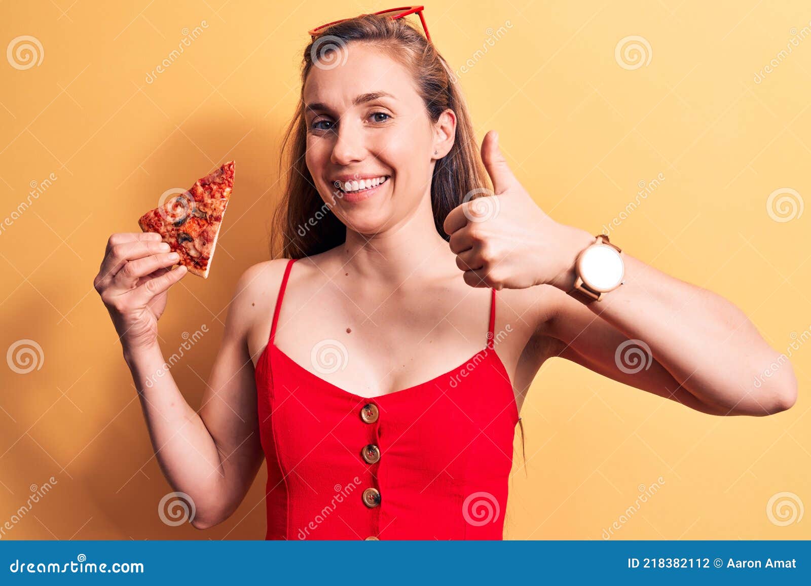 Young Beautiful Blonde Woman Eating An Slice Of Pizza Wearing Summer