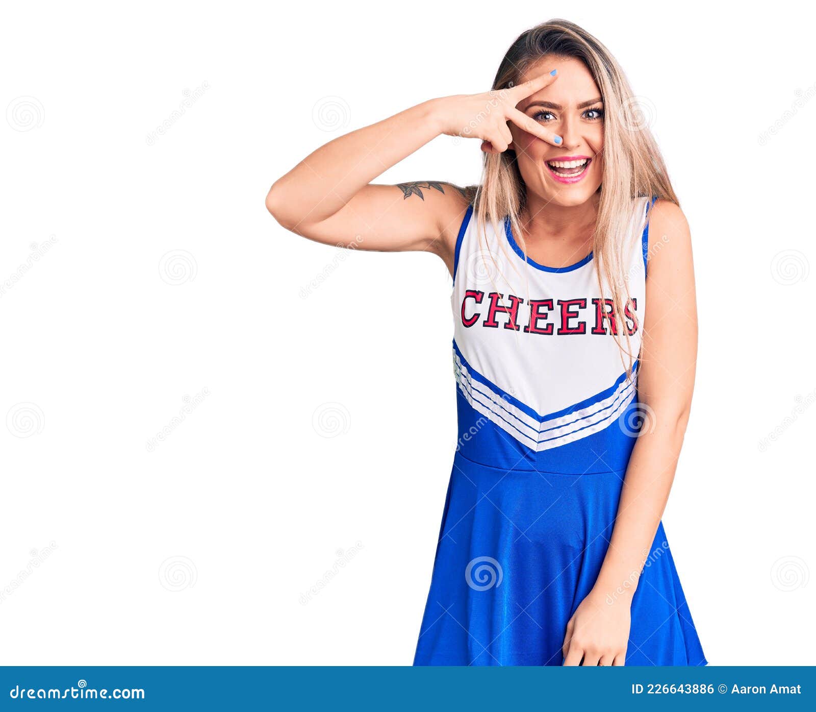 Young Beautiful Blonde Woman Wearing Cheerleader Uniform Doing Peace