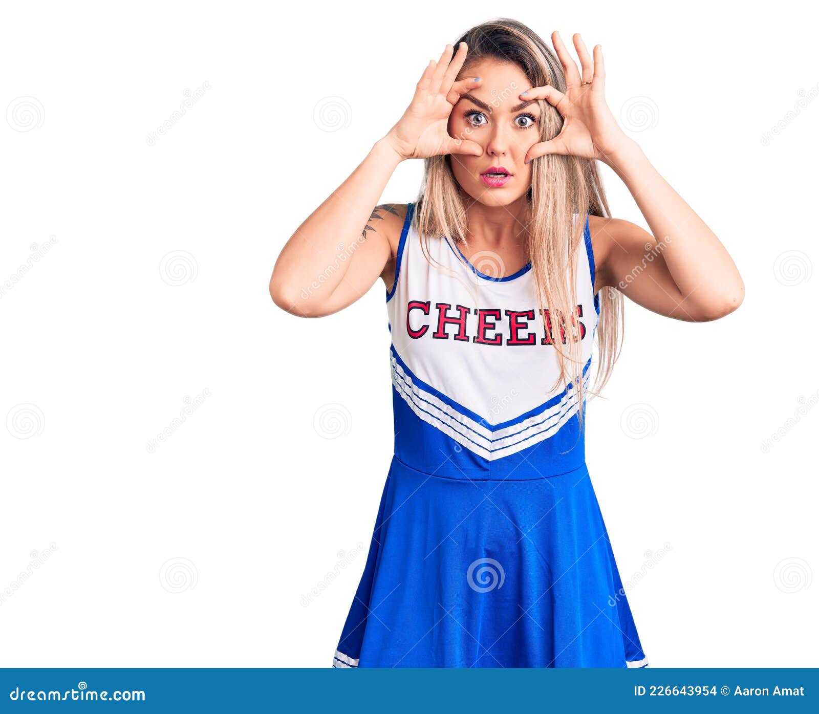 Young Beautiful Blonde Woman Wearing Cheerleader Uniform Trying To Open