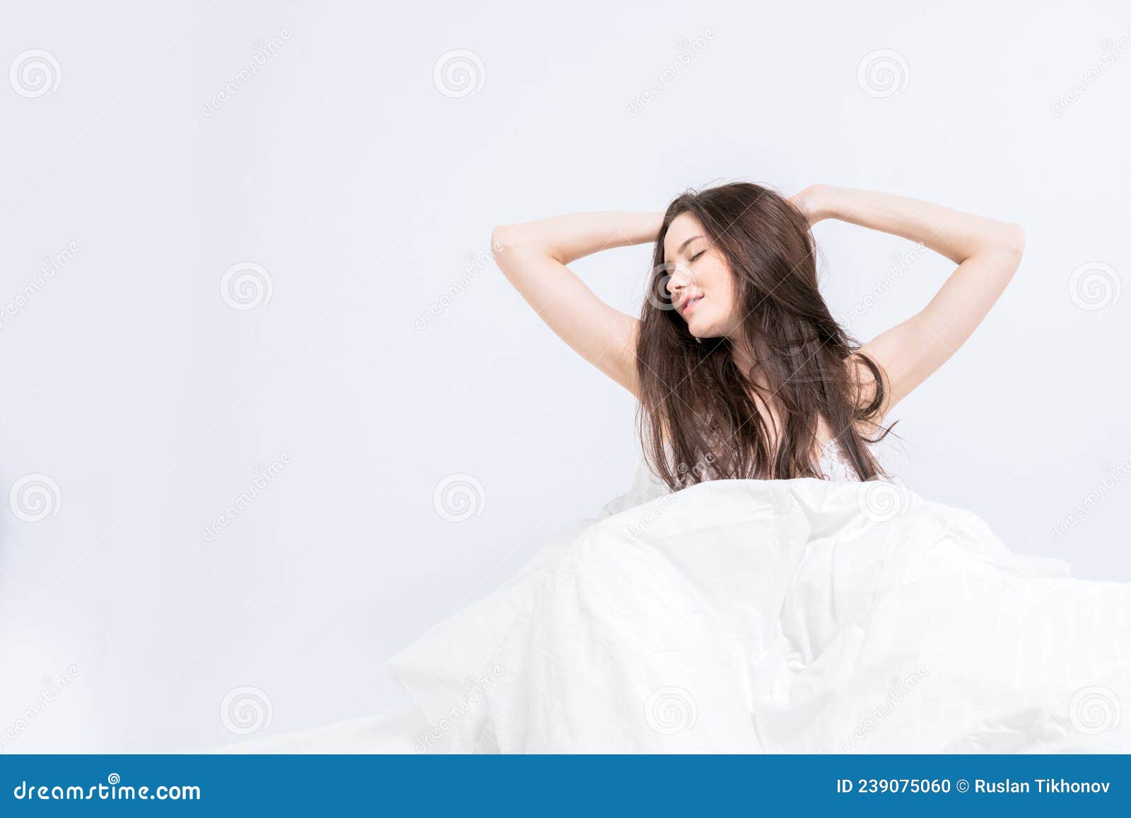 A Young Beautiful Brunette Woman Wakes Up In Her Bed Fully Rested A