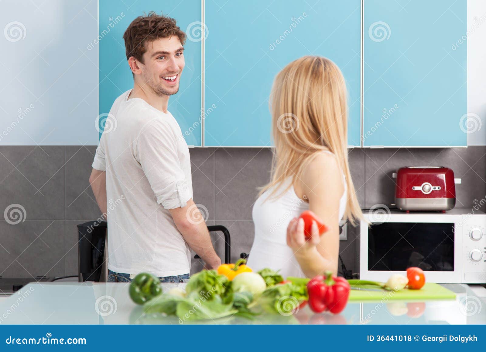 Young Beautiful Couple Cooking at Home Stock Photo - Image of green ...