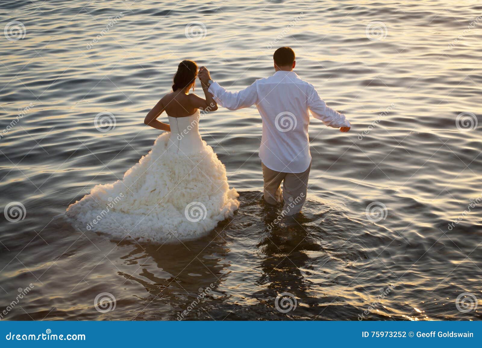 Young Beautiful Couple Dancing in Water with Sunlight Reflections Stock ...