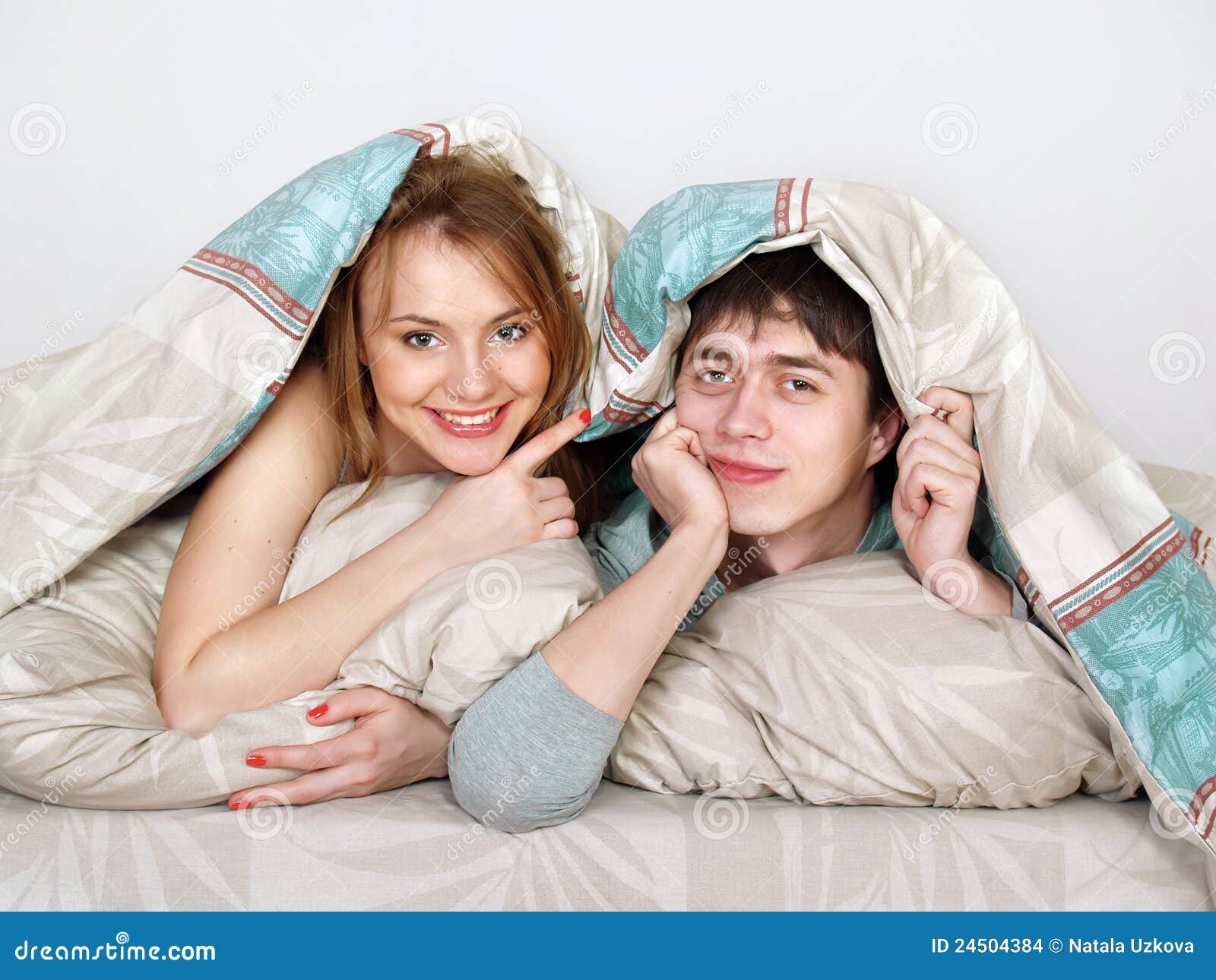 Young Beautiful Couple Under a Lanket in a Bed Stock Photo - Image of ...