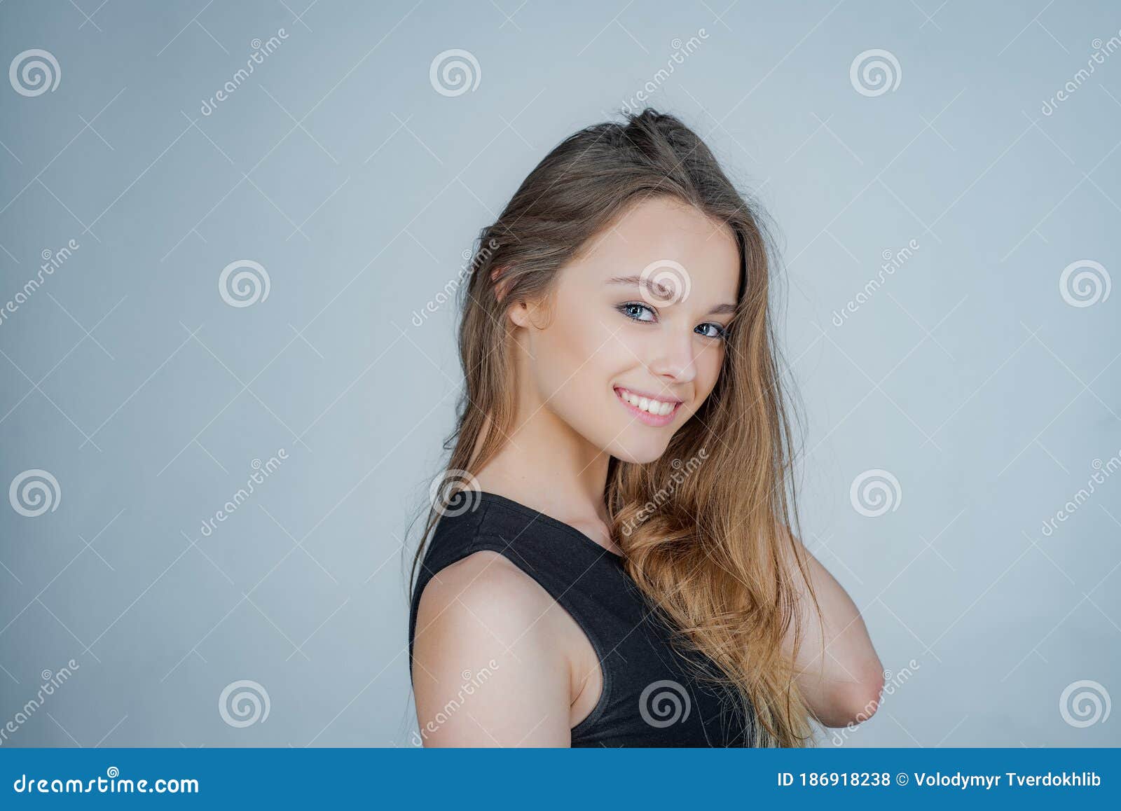 Young Beautiful Cute Cheerful Girl Smiling Looking At Camera Over White