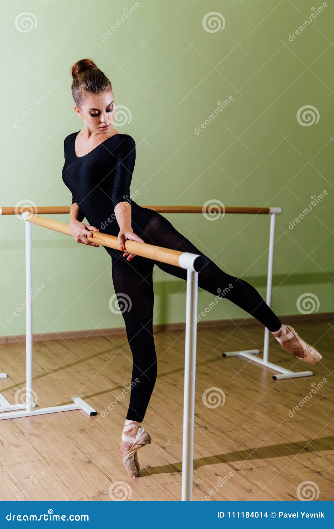 Young Beautiful Dancer Posing in Studio Wit Ballet Bar on Tiptoe ...