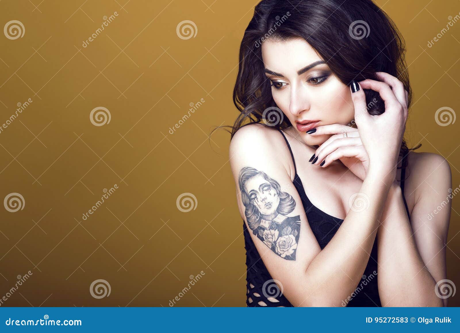 Young Beautiful Dark Haired Tattooed Woman Wearing Black Net Top