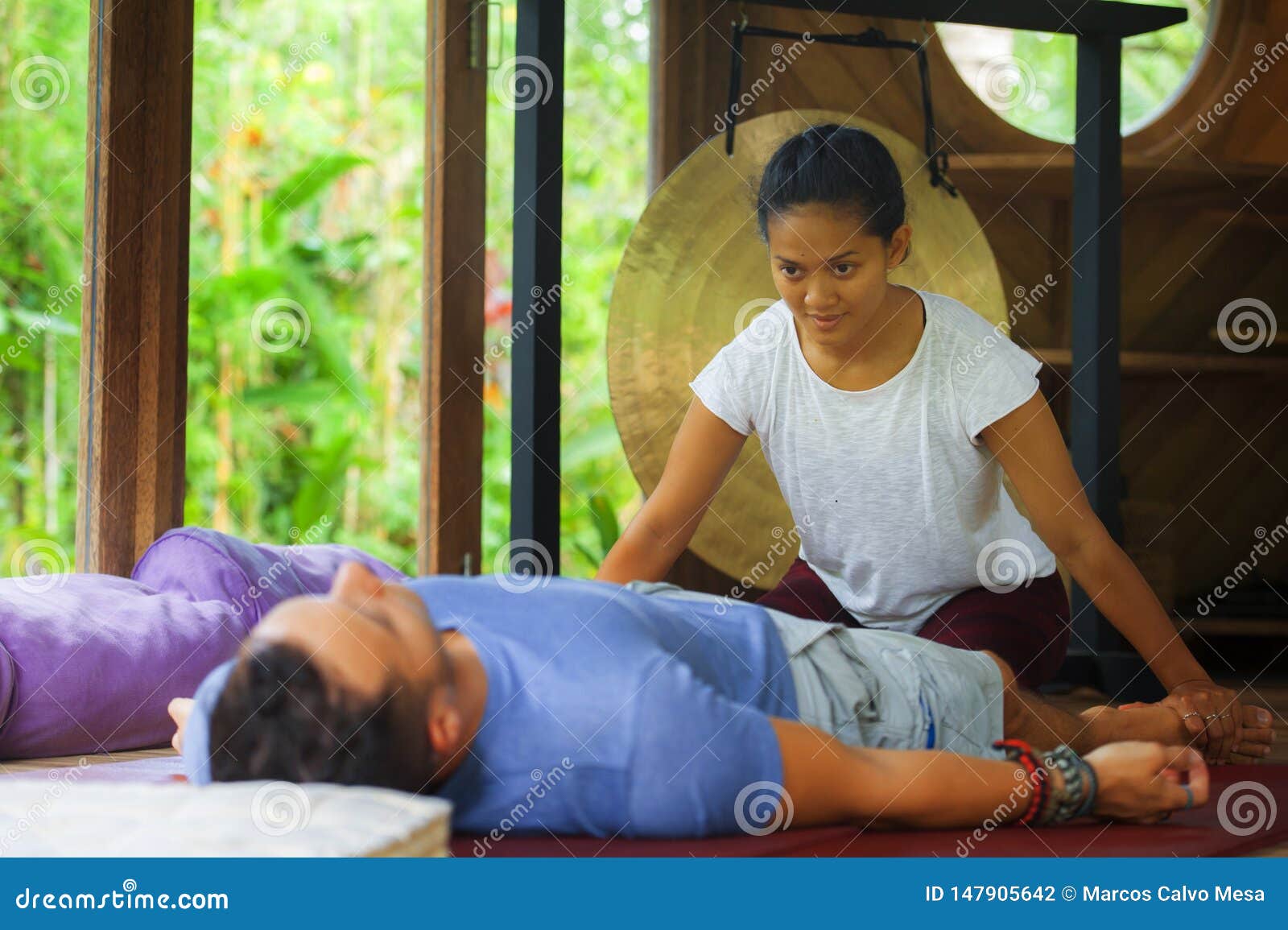 Young Beautiful And Exotic Asian Balinese Wellness Therapist Giving