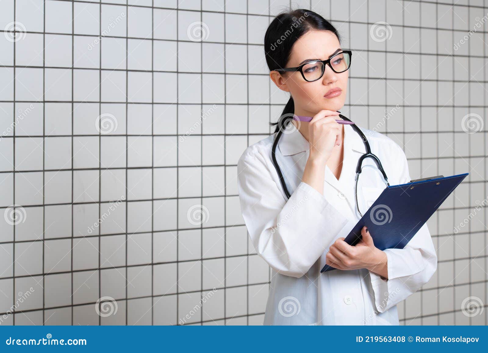 Young Beautiful Female Doctor In White Surgical Coat With Black