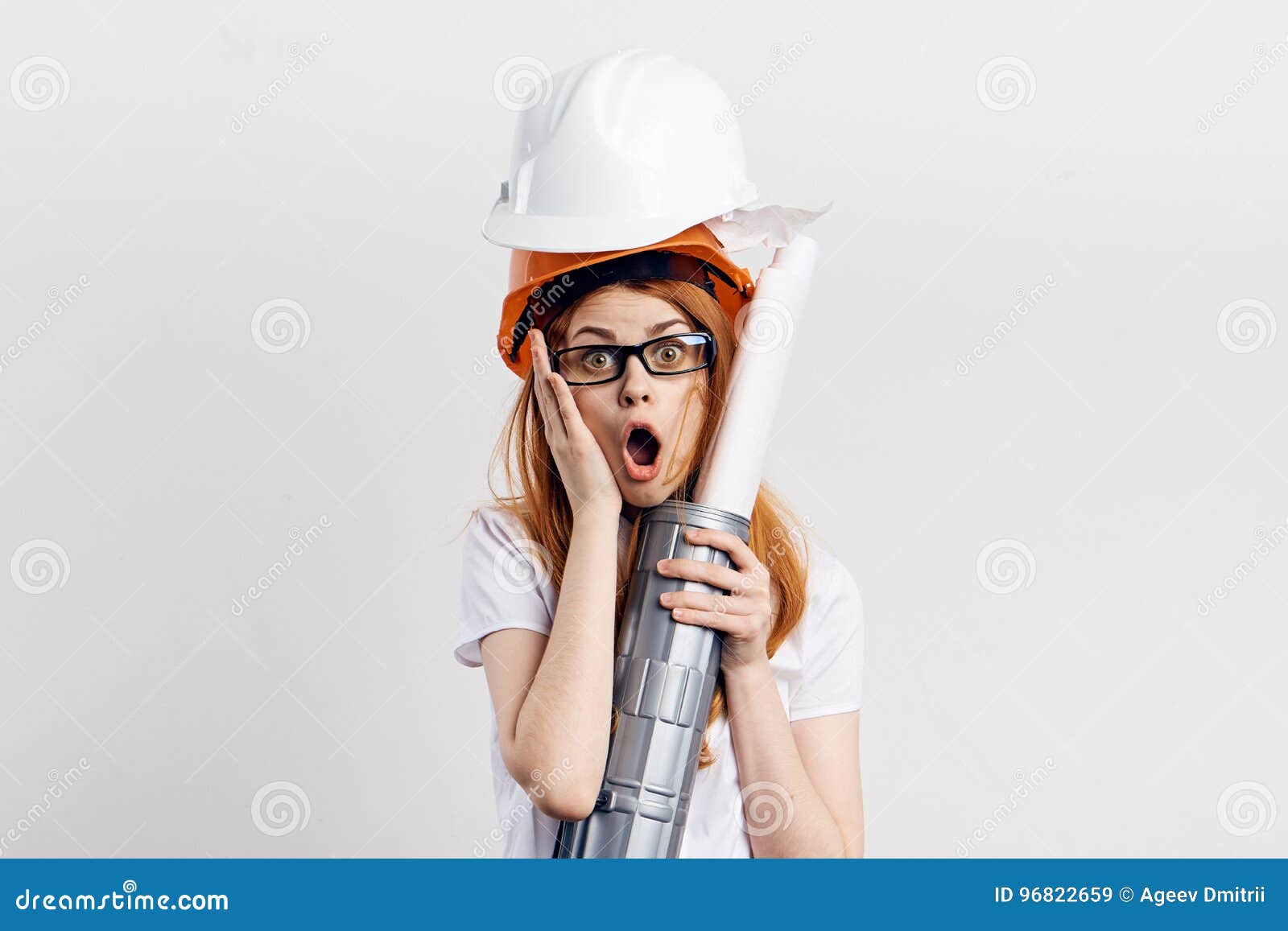 Young Beautiful Female Engineer on White Background Holds Blueprints ...